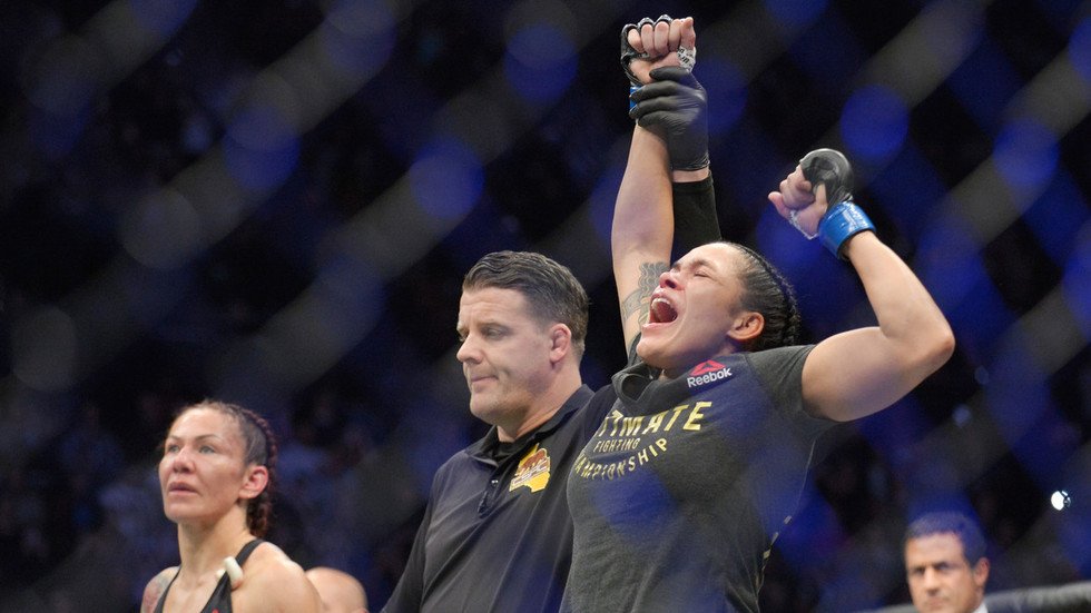 Amanda Nunes stuns Cris Cyborg to become first female two-weight champ ...