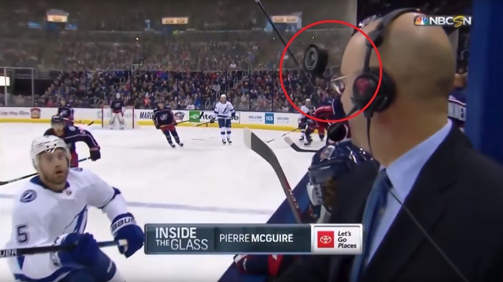 What the puck?! NHL commentator comes INCHES away from being smashed in ...