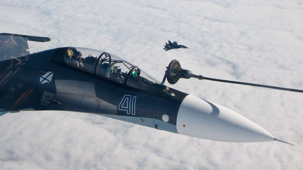 WATCH two Russian Sukhoi fighter jets refueling mid-air in stunning POV ...