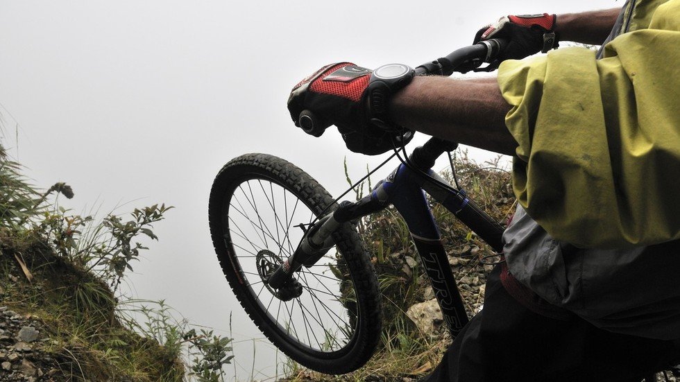 WATCH: Biker plunges off 70ft cliff in horror crash… but somehow ...