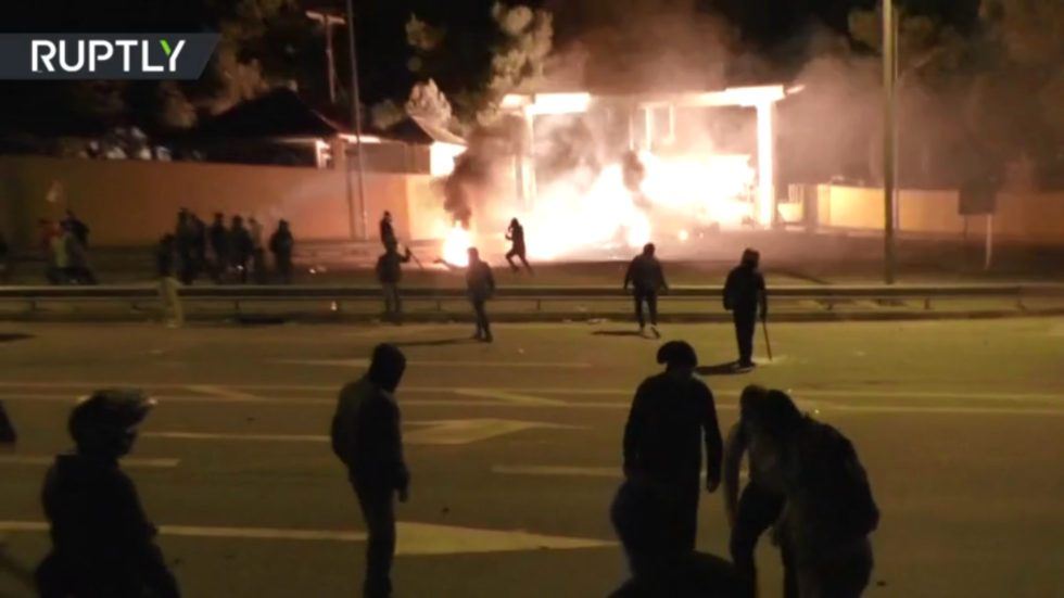 WATCH protesters hurl stones at police during second night of riots ...