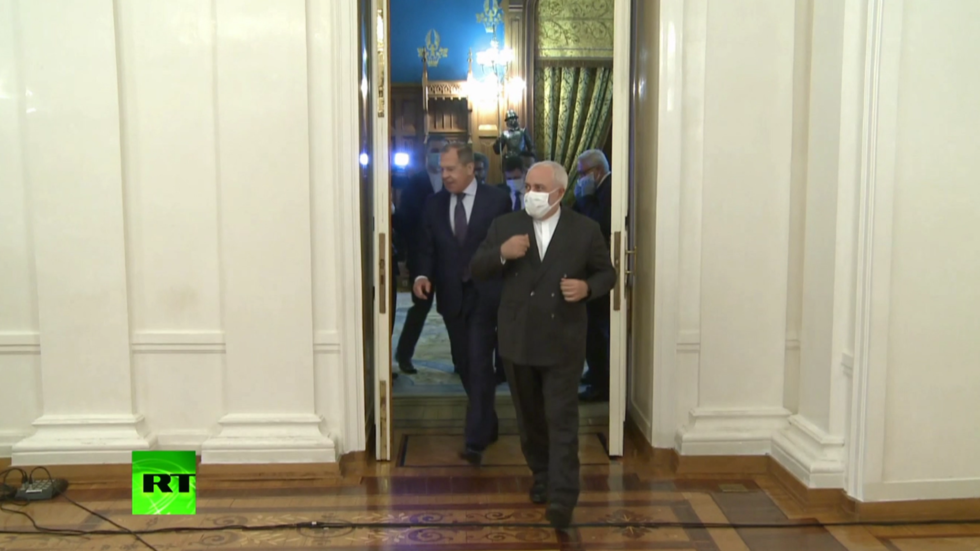 WATCH Iran’s Zarif remove face mask with relief during Moscow talks ...
