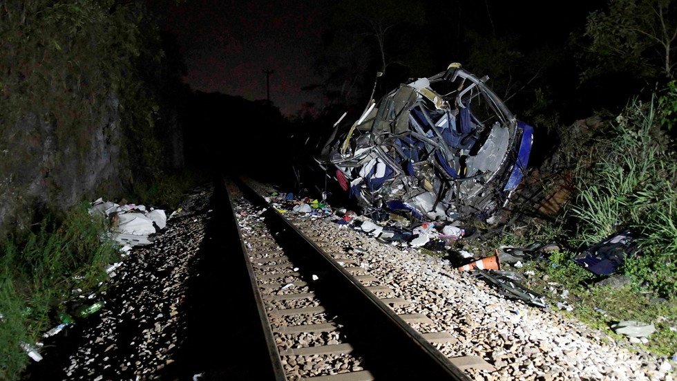 Bus FALLS from a bridge in Brazil to train tracks below, killing at ...