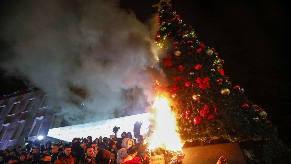 Cheering Albanians torch Christmas tree amid fiery protests in capital ...