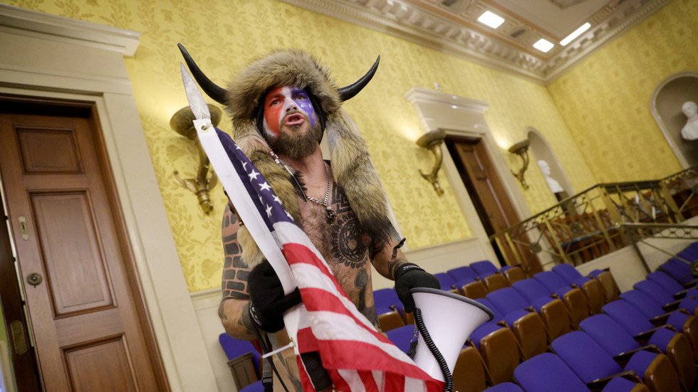 Horned ‘QAnon shaman’ Capitol invader arrested on federal charges as ...