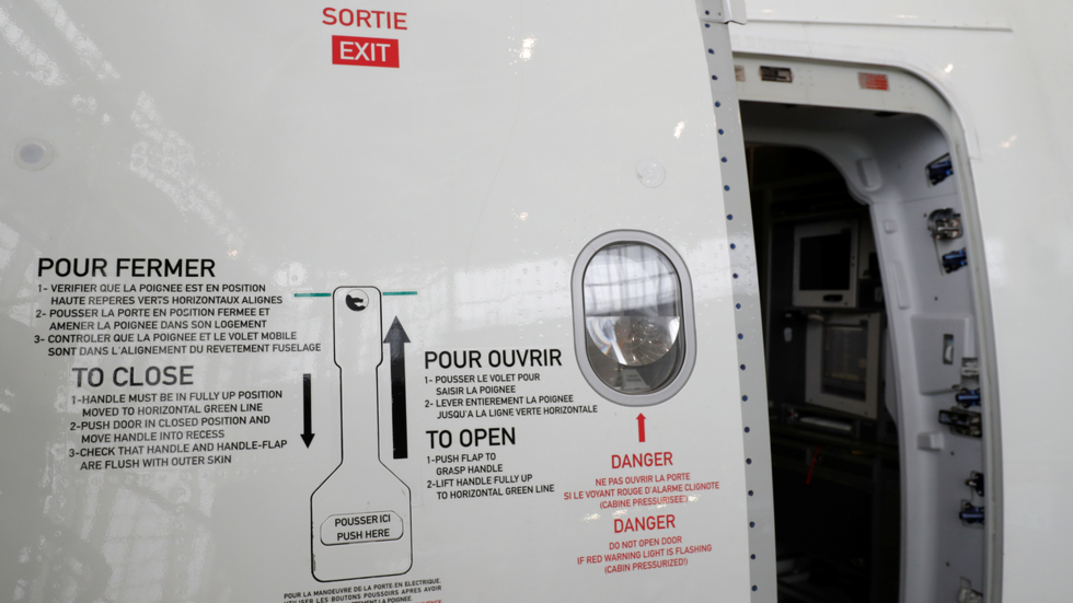 WATCH: Man attempts to open passenger plane door mid-flight from LA ...