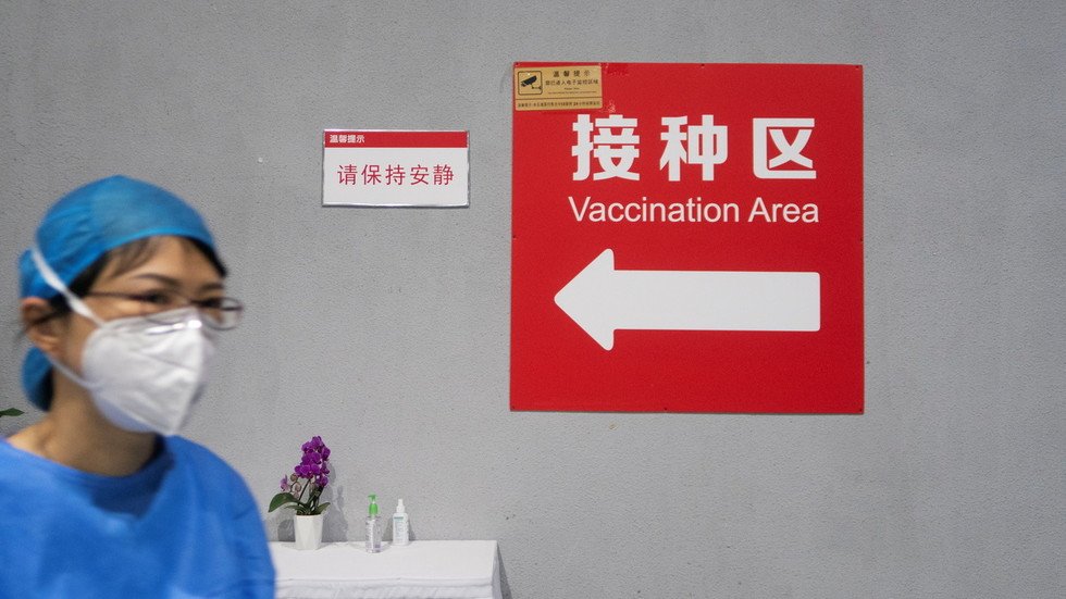 China passes BILLION Covid shots mark as Beijing ratchets up ...