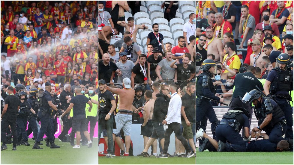 Turf wars: Riot police confront thugs on pitch as violent chaos breaks ...