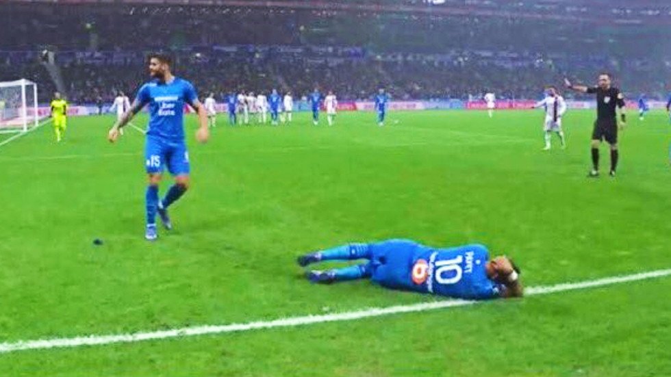 Chaos in France again as game stops after footballer is hit on head by ...