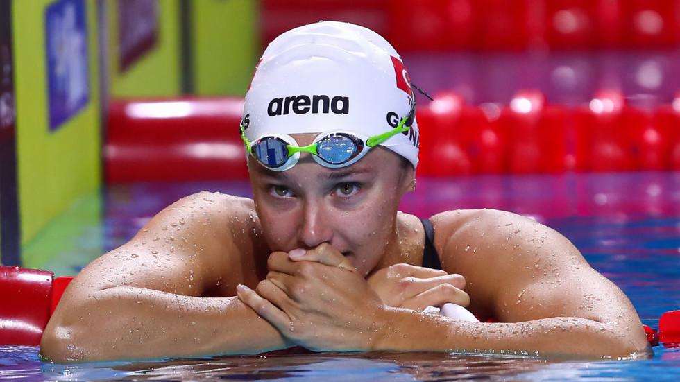 Swimming chiefs react to Ukraine-born champ’s provocative Russian flag ...